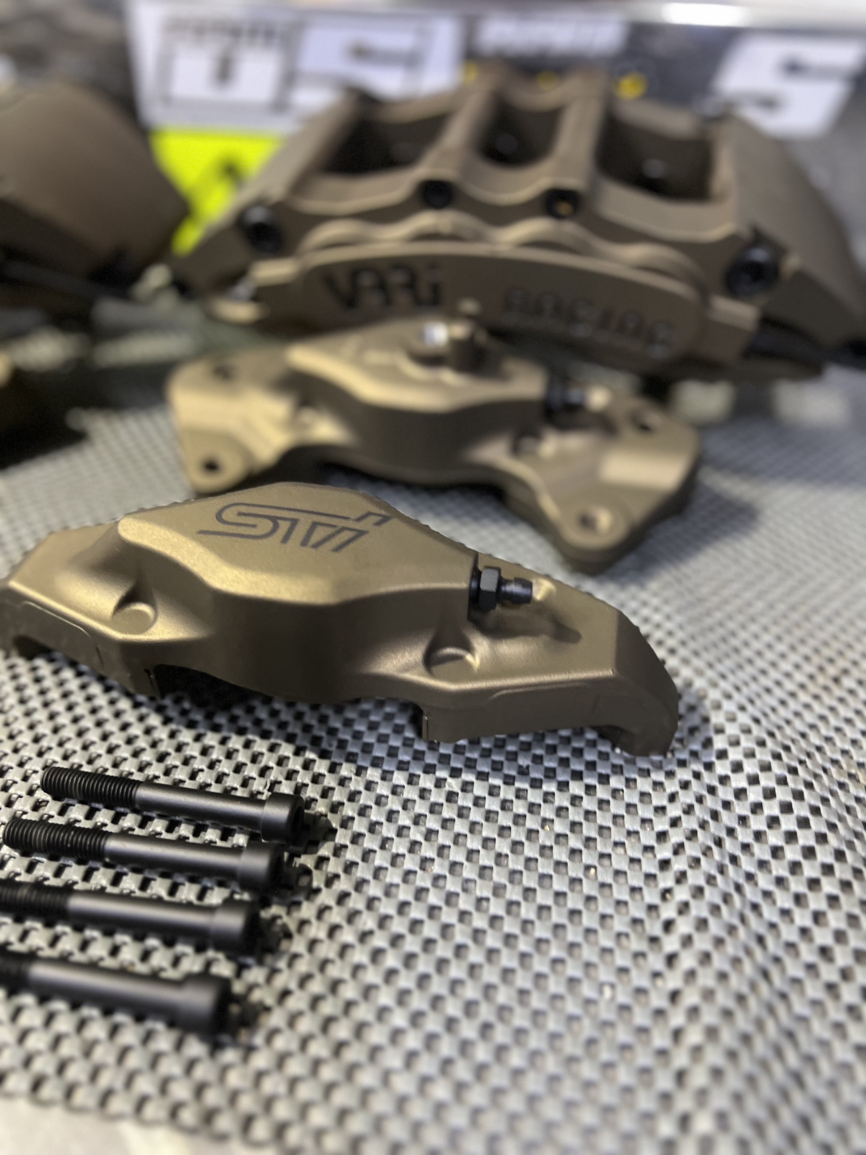 Subaru Brake calipers - burnt bronze with black lettering | Cerakote