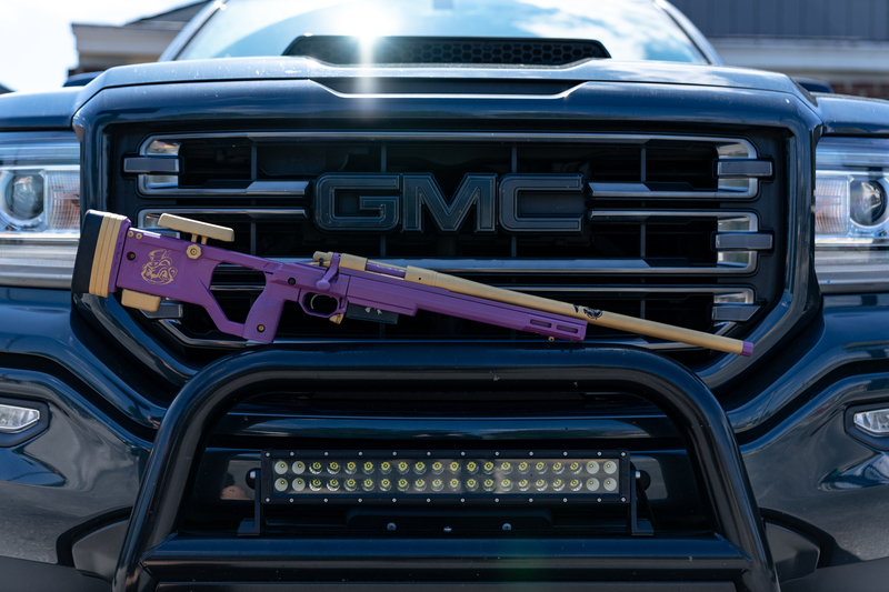 Two Toned Bolt Action Rifle with a Two Toned Purple and Gold Cerakote ...