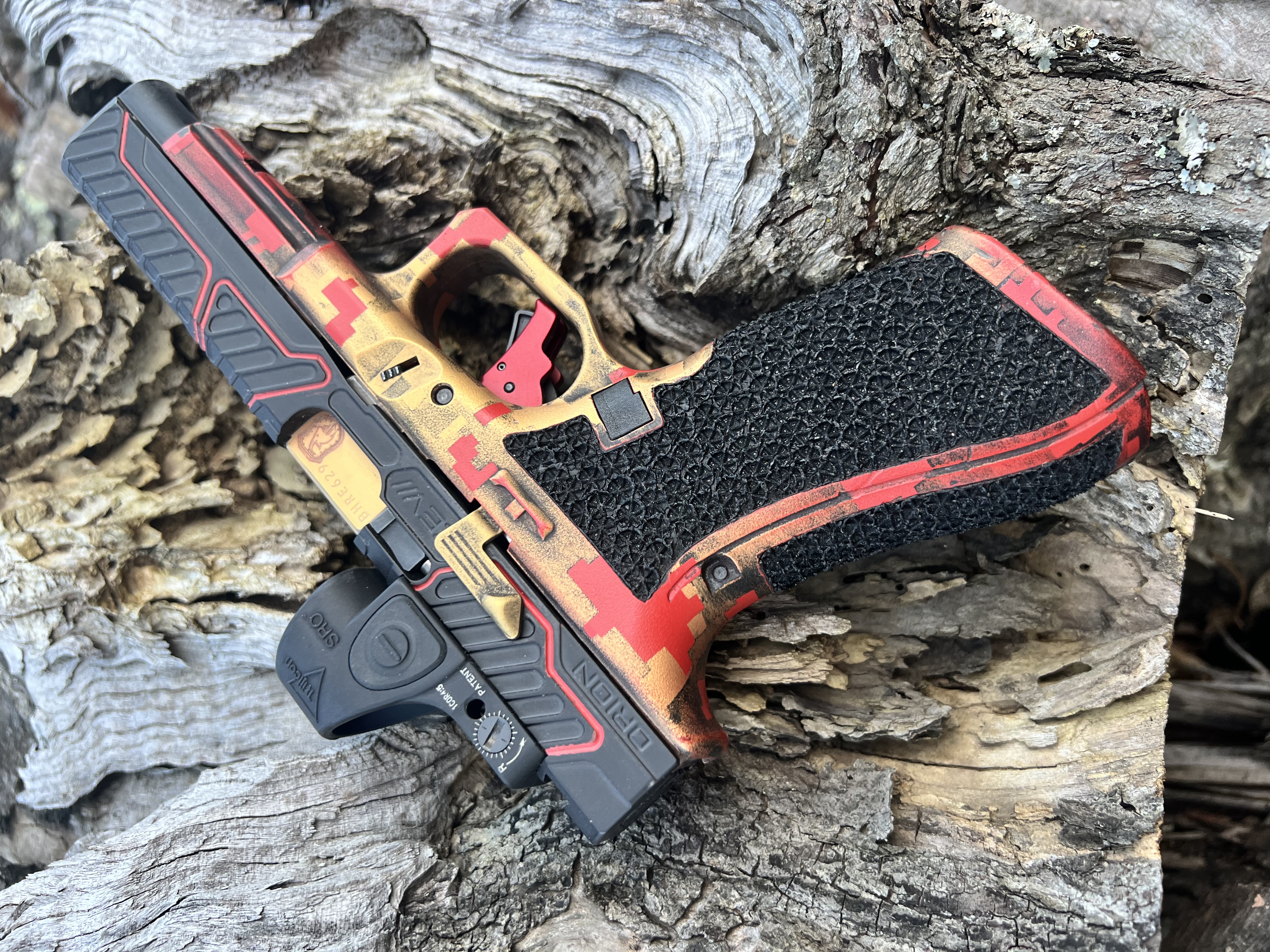 Pistol featuring a Graphite Black, Firehouse Red and Gold Finish | Cerakote