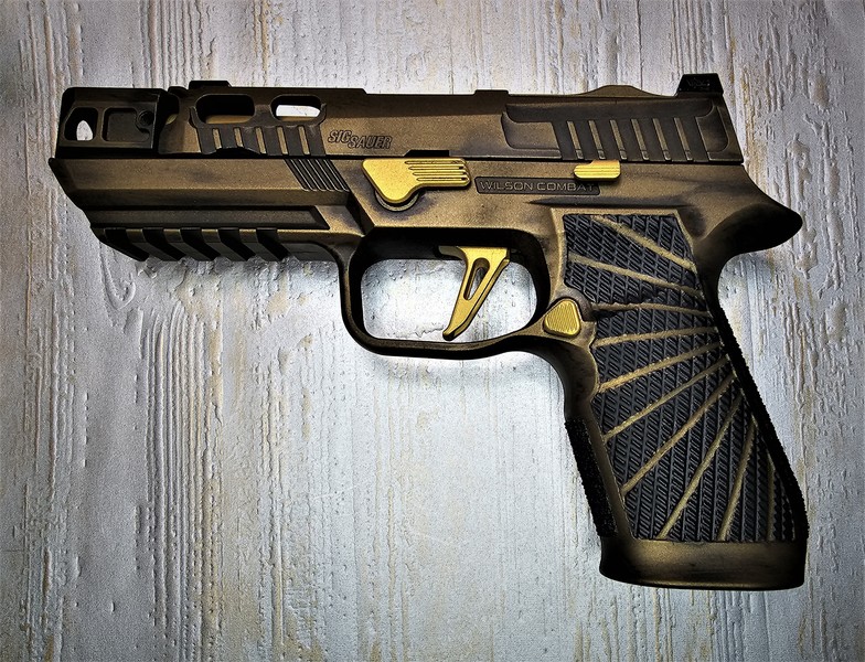 Battleworn Handgun with Gold Accents | Cerakote